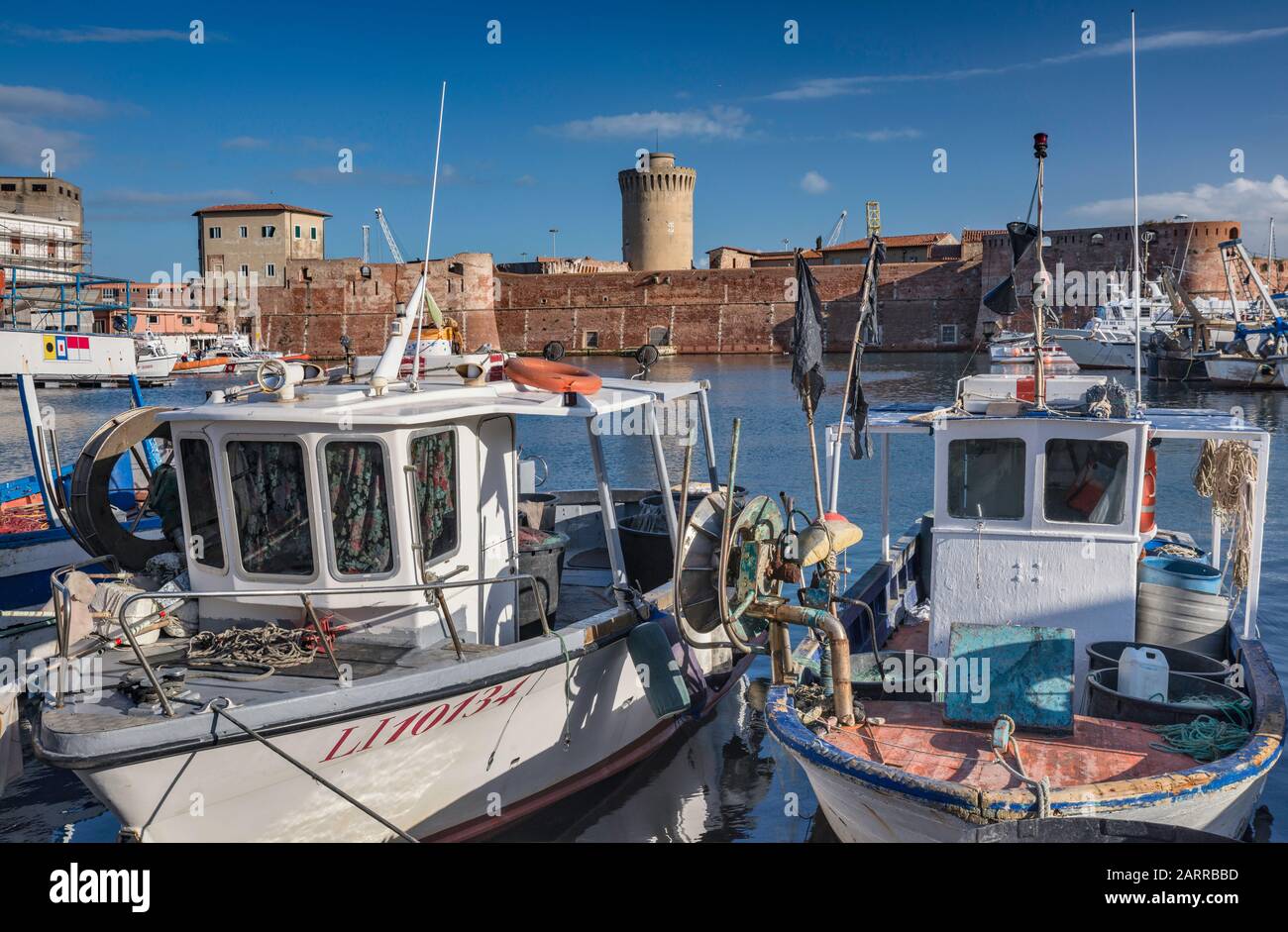 Fishing boats at port, Fortezza Vecchia (Old Fortress), medieval fort ...