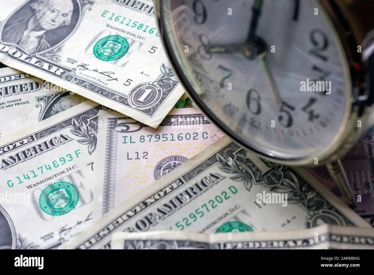 Money clock dollar signs hi-res stock photography and images - Alamy