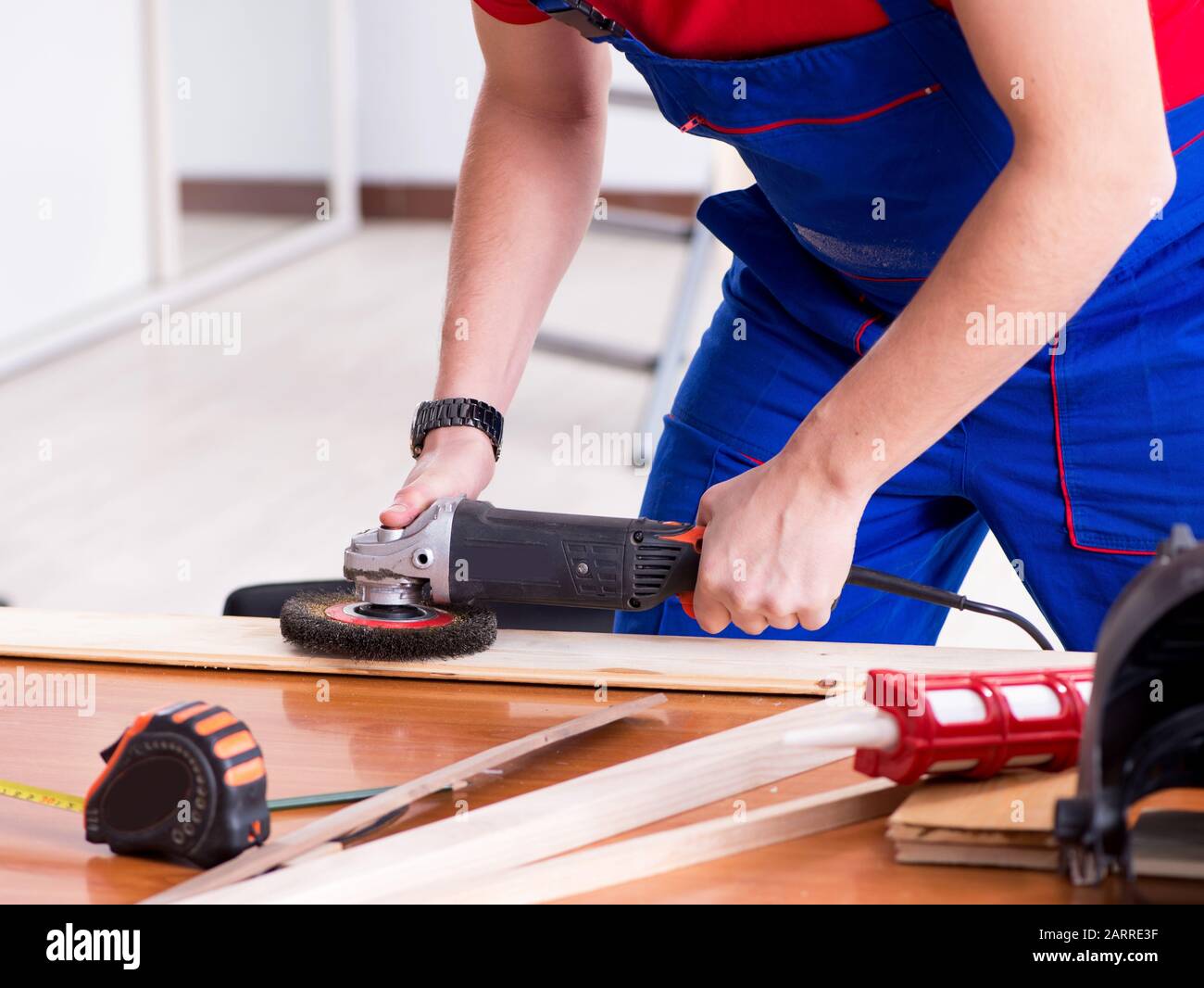 The contractor working in the workshop Stock Photo - Alamy