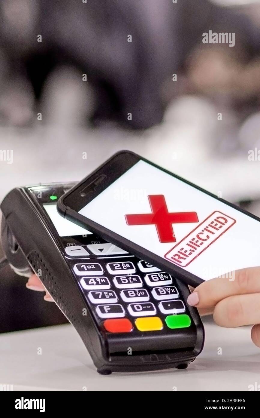 POS terminal, Payment Machine with mobile phone on store background ...