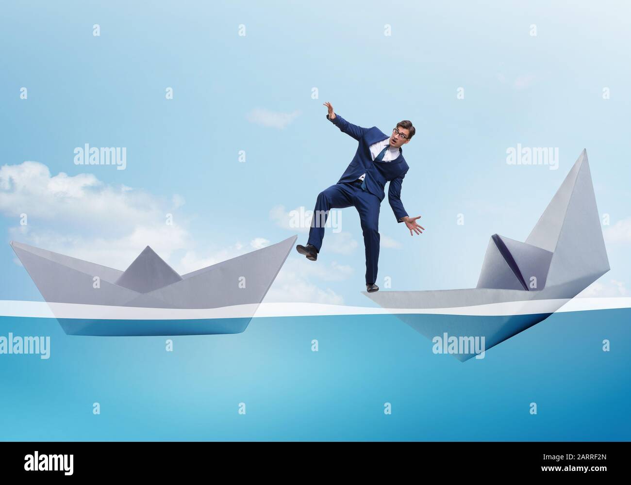 The businessman escaping sunken paper boat ship Stock Photo - Alamy