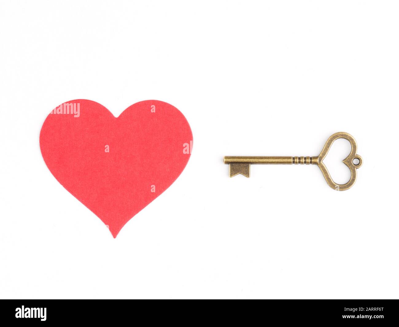 Image of a heart and a vintage key isolated on a white. Love ...