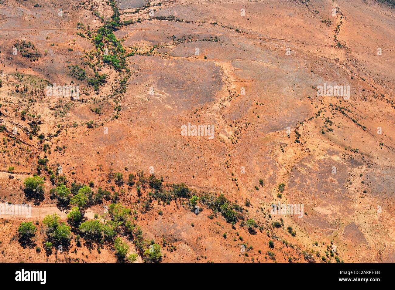 Australia, NT, aerial view over outback landscape with dry river bed ...