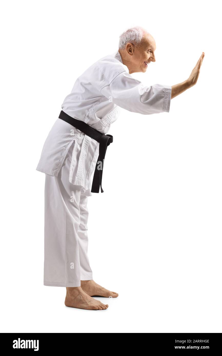 Full length profile shot of a senior karate master gesturing high five ...