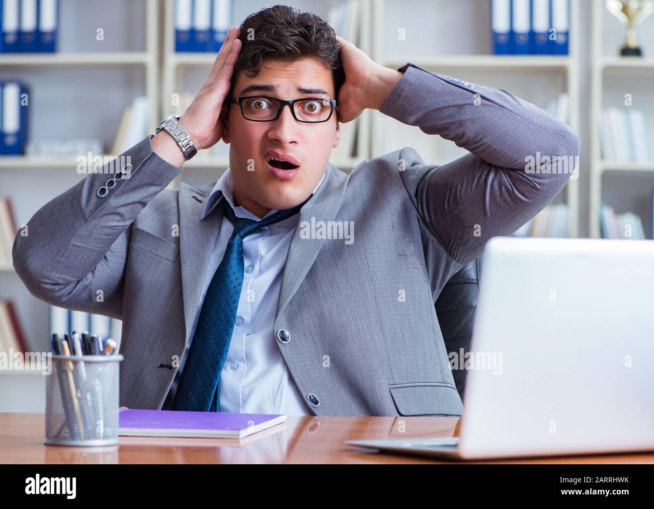 Businessman sweating excessively smelling bad in office at workplace ...