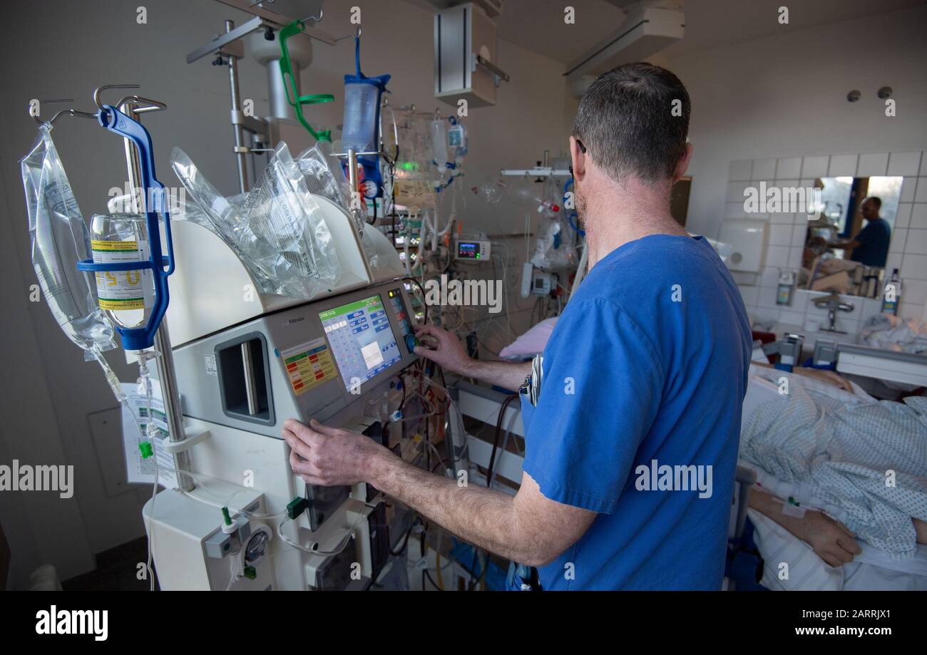 Germany. 20th Jan, 2020. A doctor operates a dialysis machine in an ...