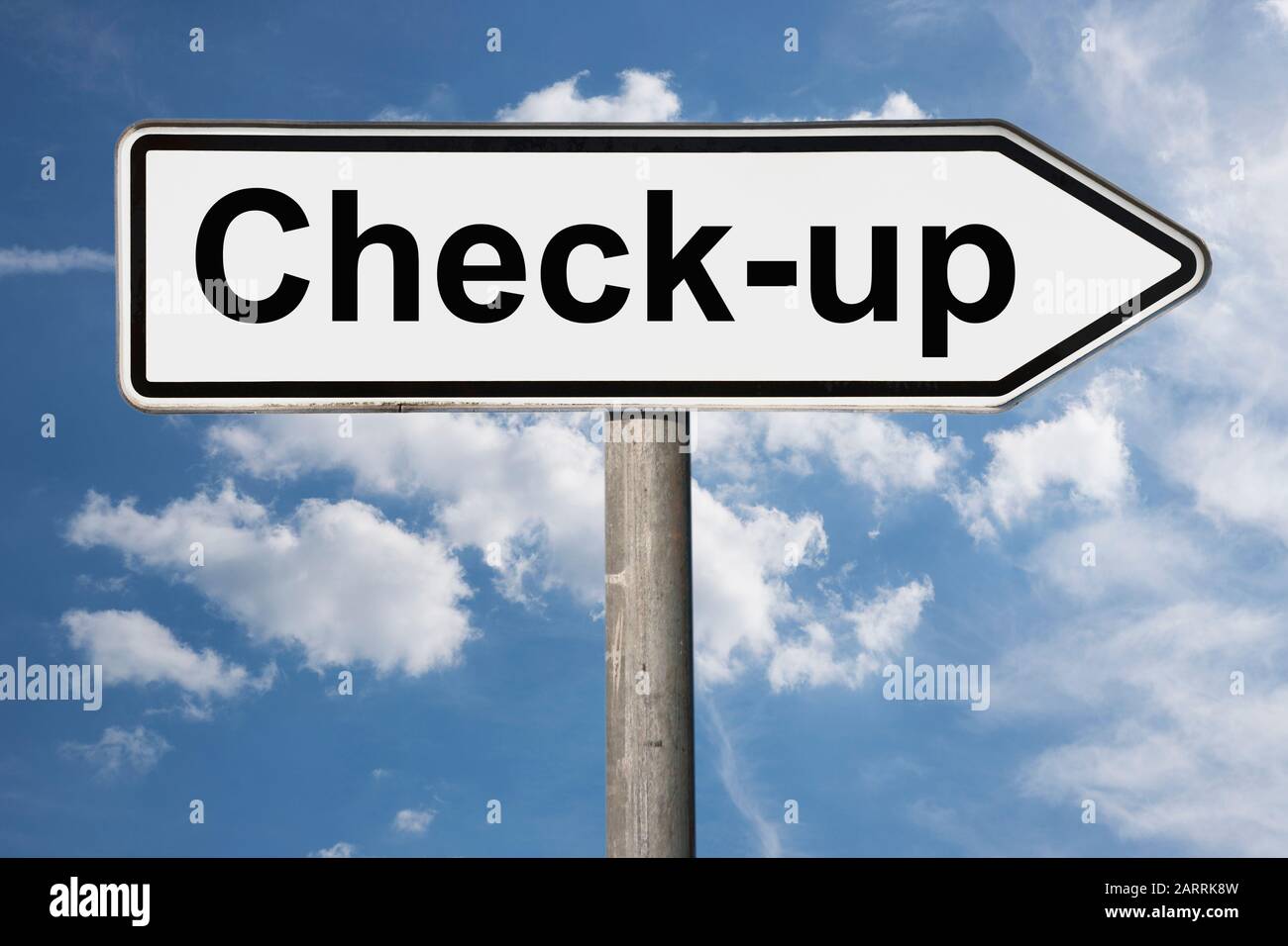 Detail photo of a signpost with the inscription Check-up (Routine ...