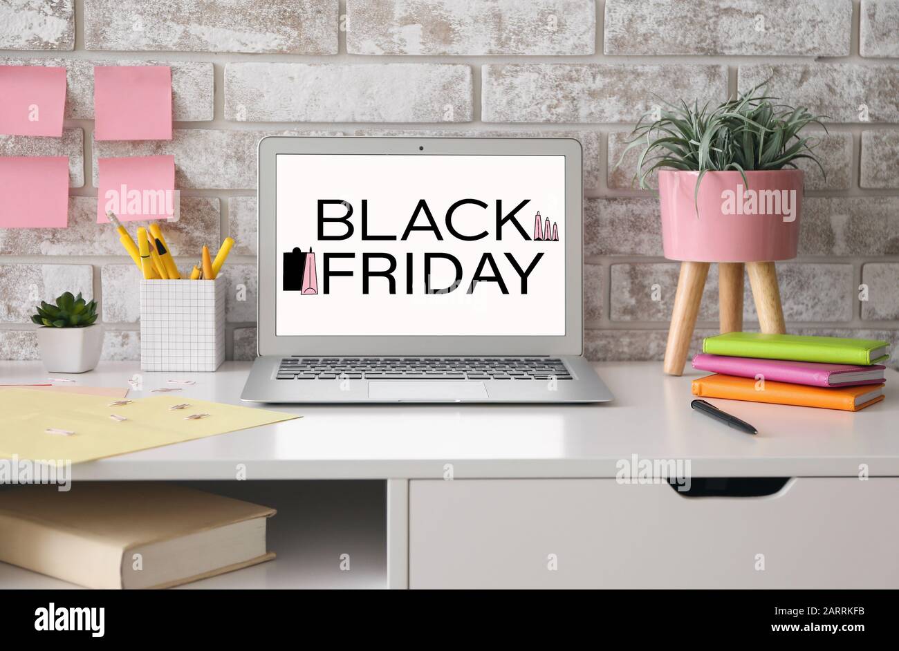 Laptop with text BLACK FRIDAY on screen at workplace Stock Photo - Alamy