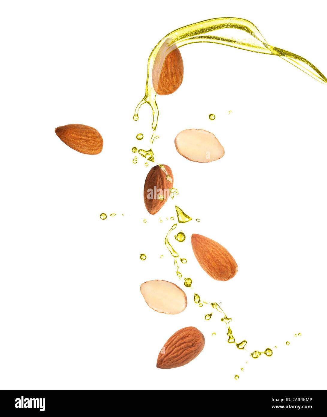 Splash of almond oil and nuts on white background Stock Photo - Alamy