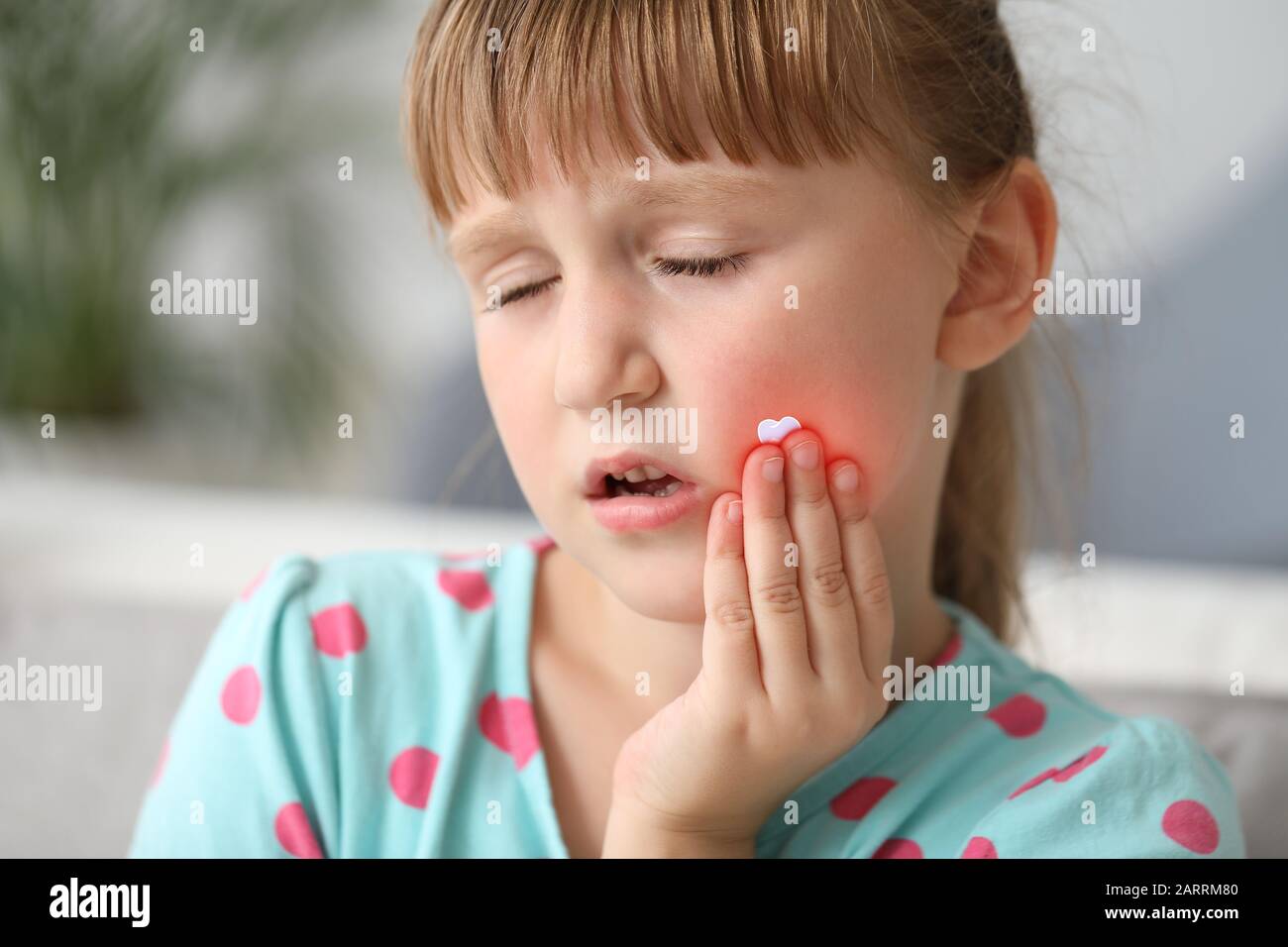 Little girl suffering from toothache at home Stock Photo - Alamy