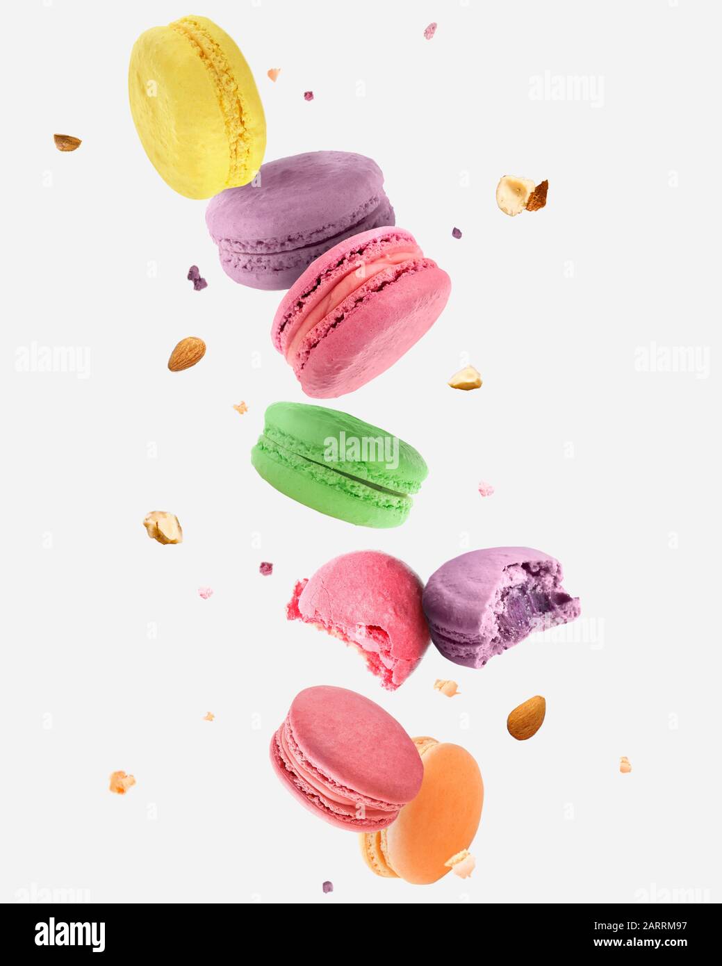 Falling tasty macarons on white background Stock Photo - Alamy