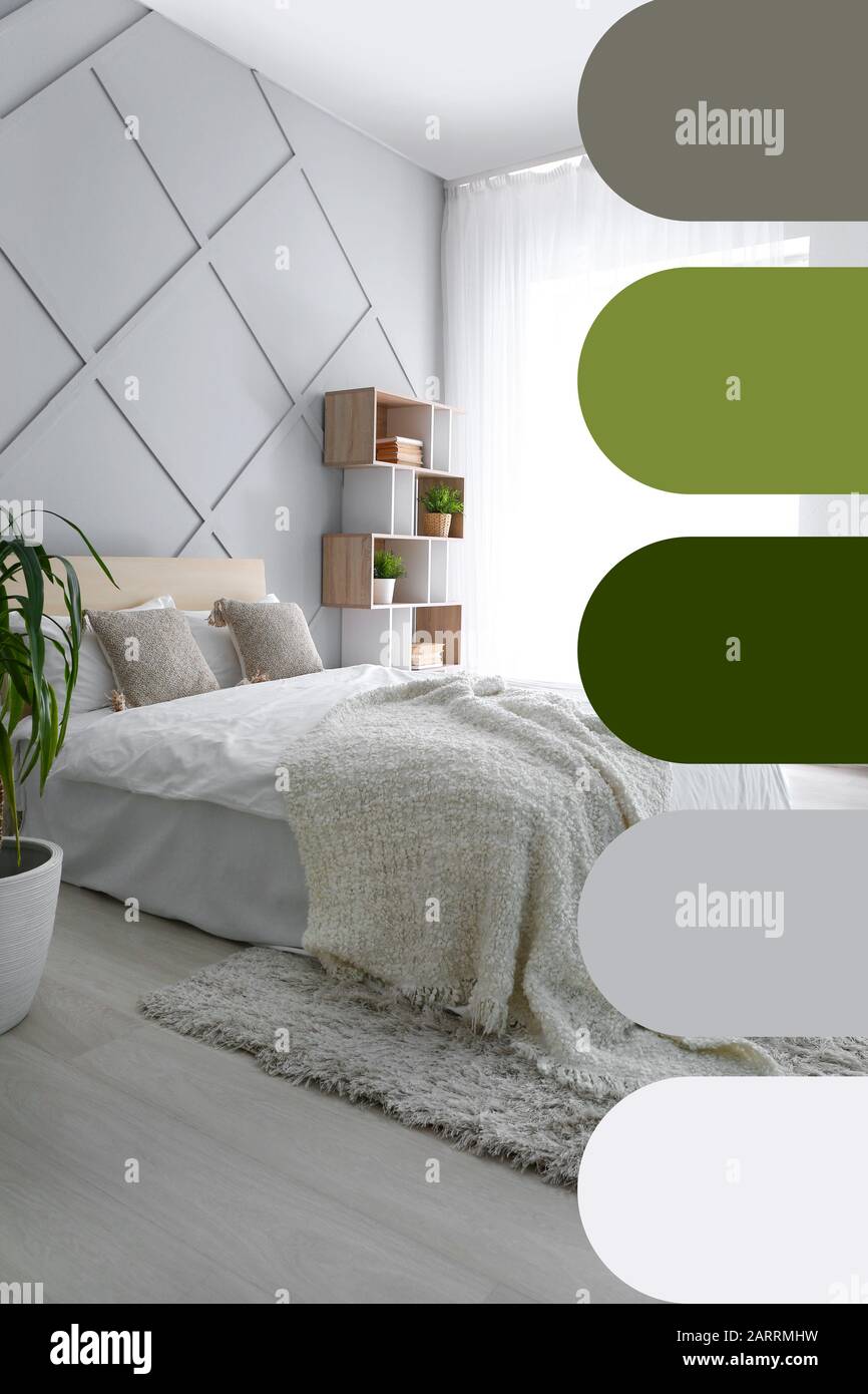 Stylish interior of room with big comfortable bed. Different color ...