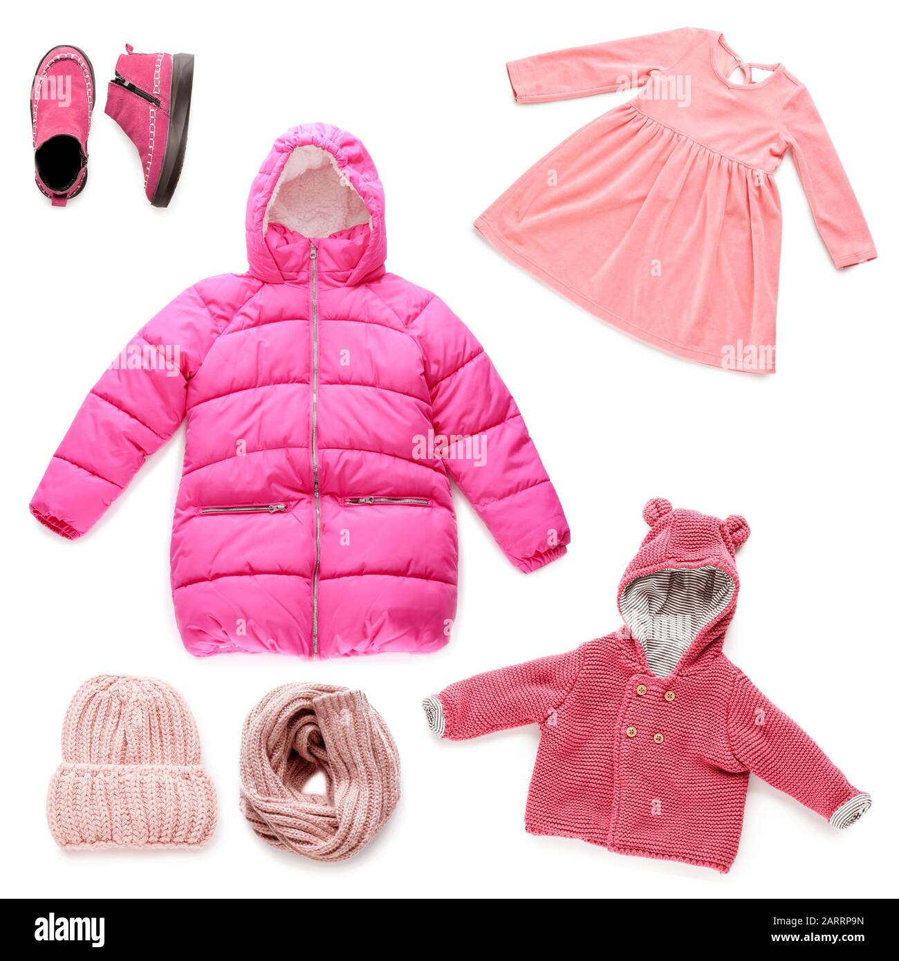 Set of pink kid clothes on white background Stock Photo - Alamy