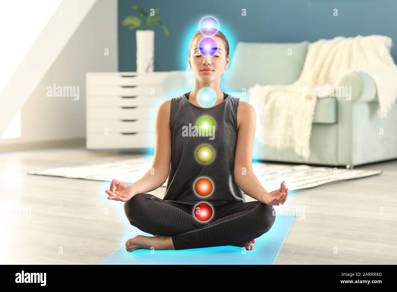 Meditating woman with drawn chakras at home Stock Photo - Alamy