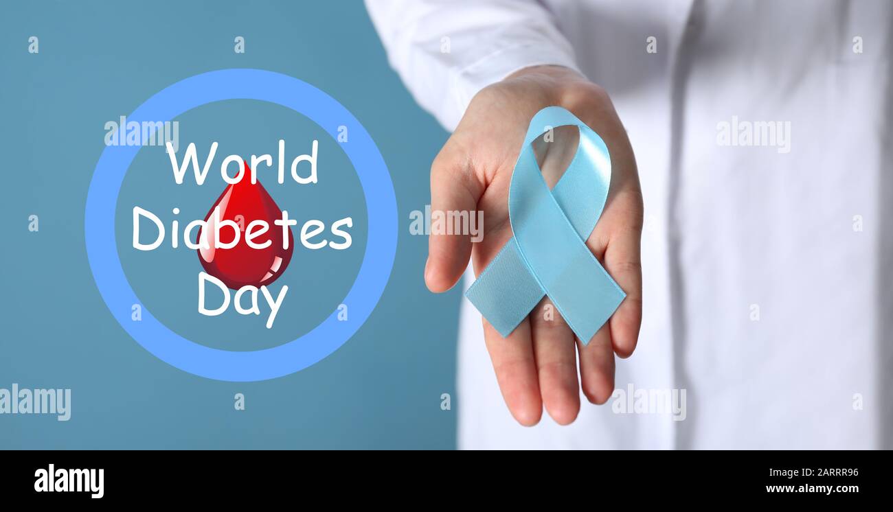 Female doctor with blue ribbon on color background, closeup. World ...