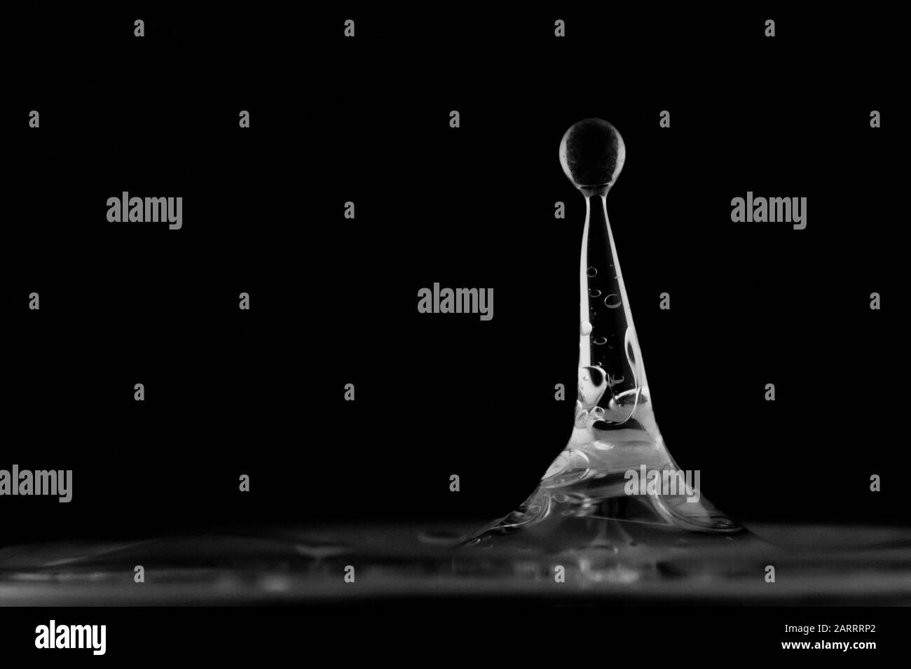 Water splash isolated, water drop hit the surface, water droplet ...