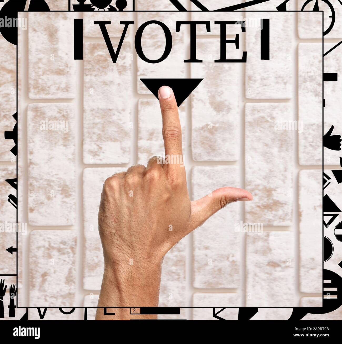 Male hand pointing at word VOTE on brick background Stock Photo - Alamy