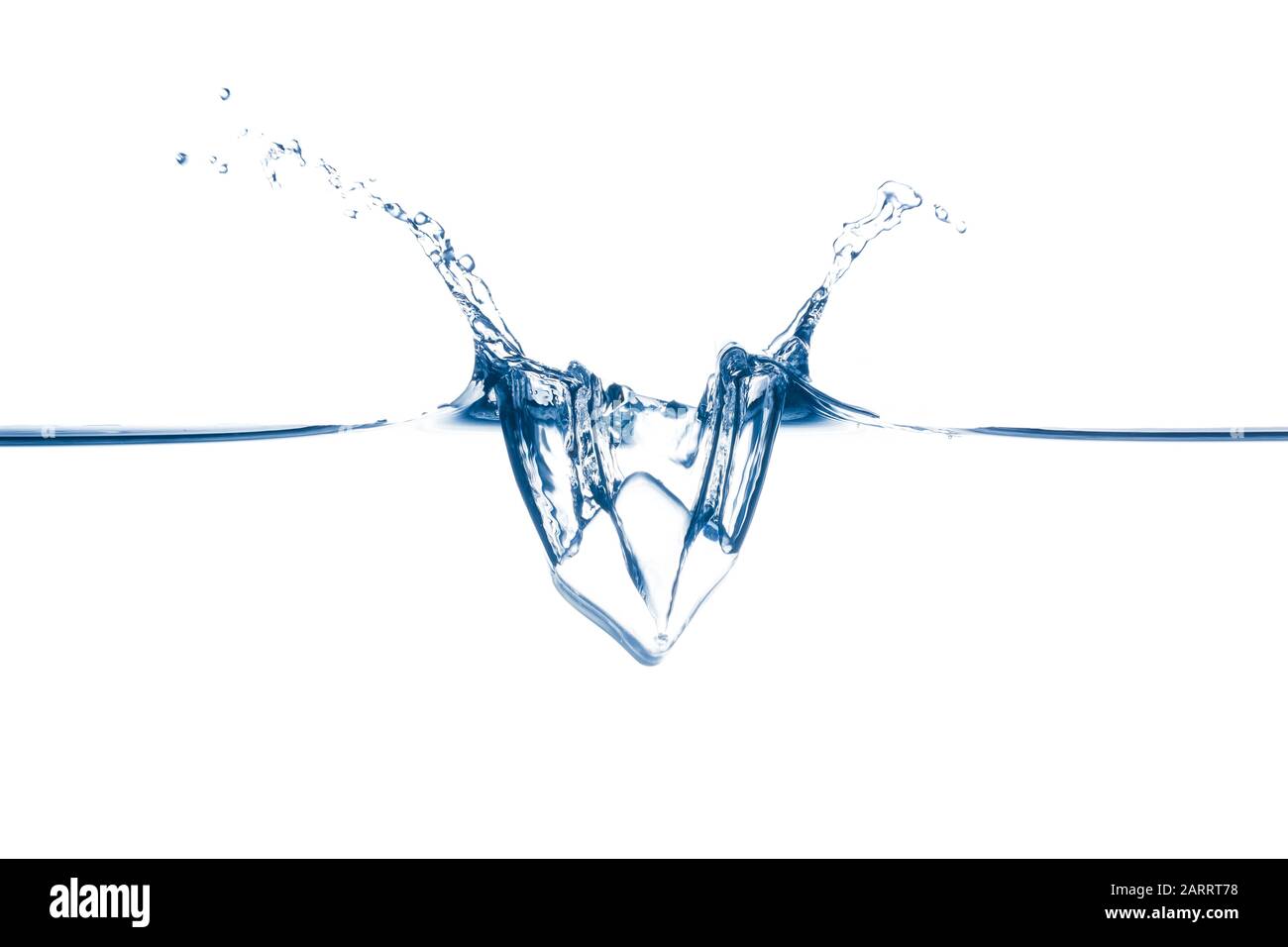 Ice cube splashing on water surface, white background Stock Photo - Alamy