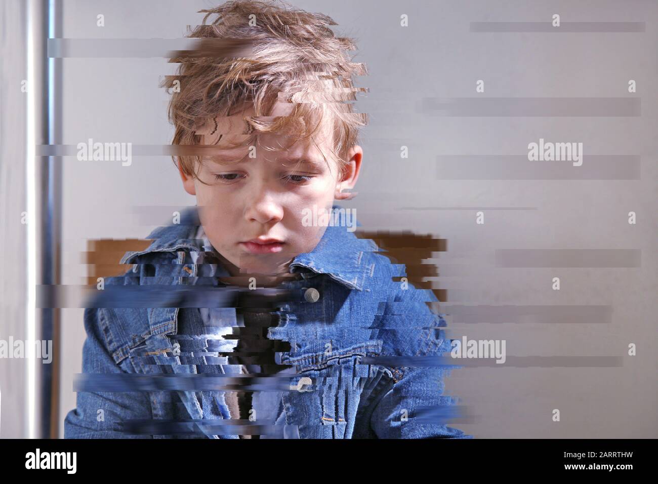 Portrait of depressed little boy indoors Stock Photo - Alamy