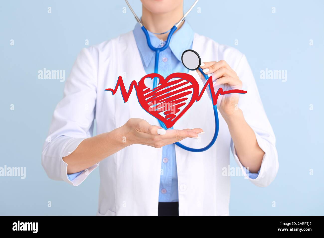 Female cardiologist with drawn heart on color background Stock Photo ...