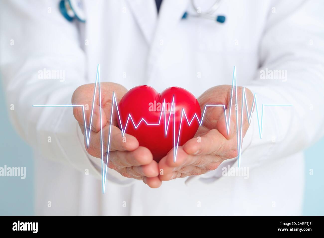 Male cardiologist with red heart and cardiogram, closeup Stock Photo ...
