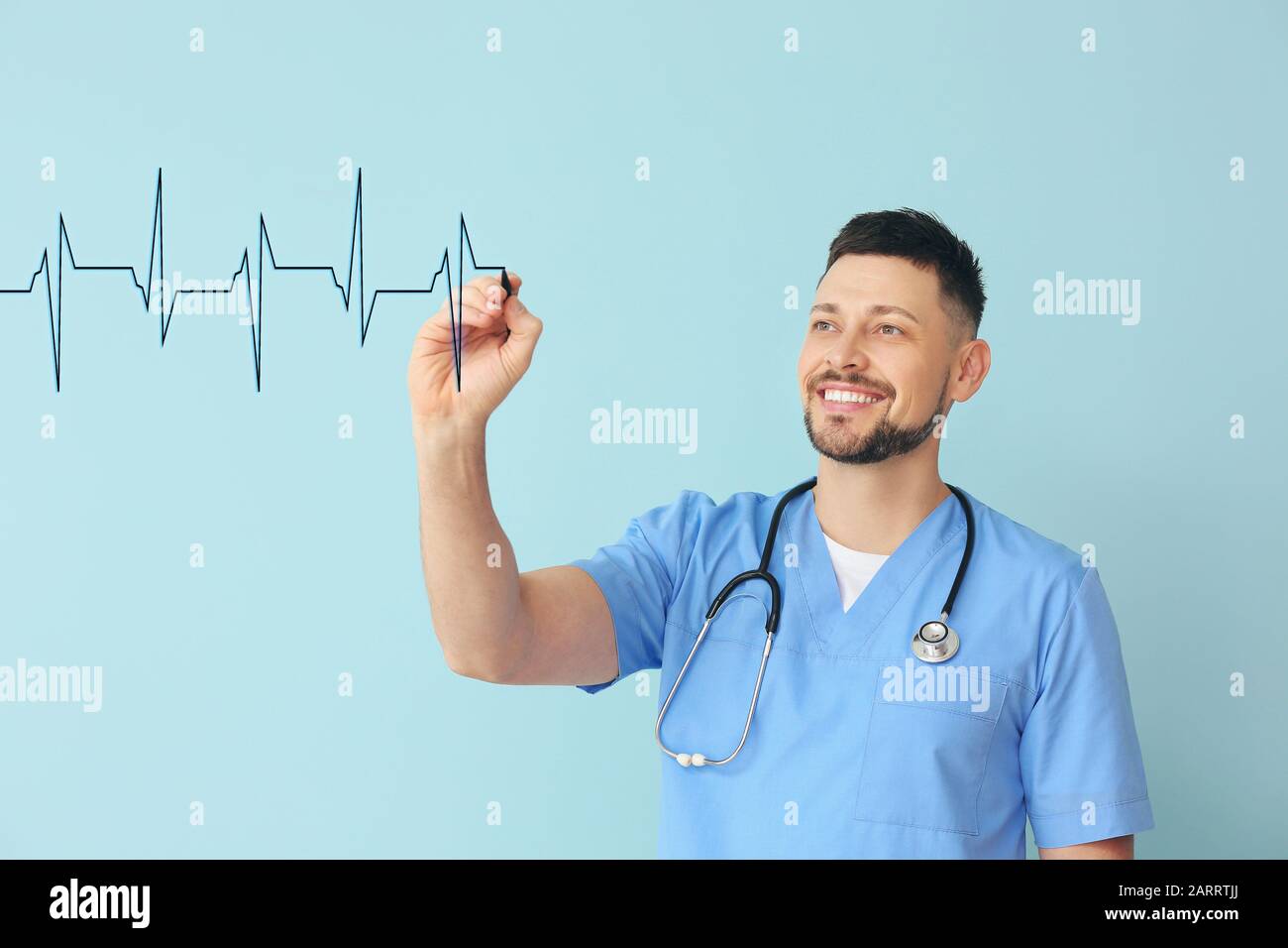 Male cardiologist drawing cardiogram against color background Stock ...