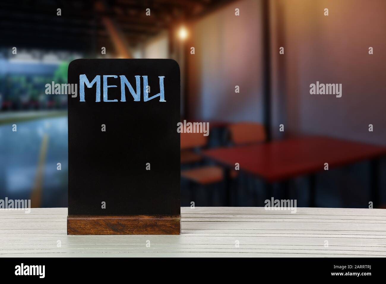 Blank menu on table in modern cafe Stock Photo - Alamy