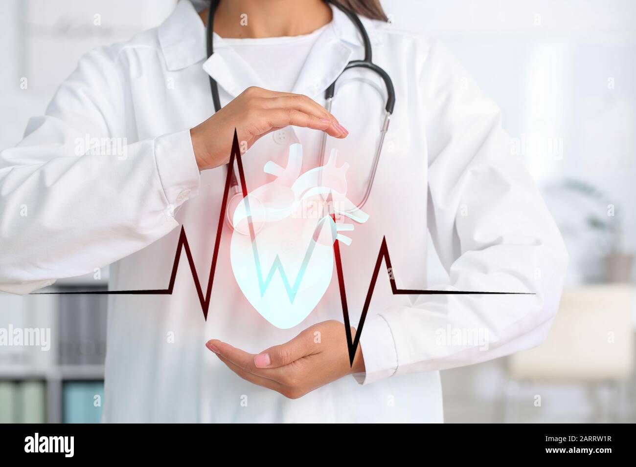 Female cardiologist with drawn heart in modern clinic Stock Photo - Alamy
