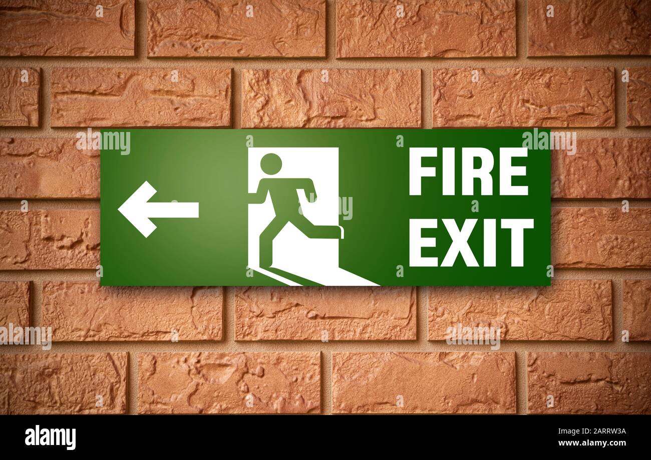 Sign of emergency fire exit on brick wall Stock Photo - Alamy
