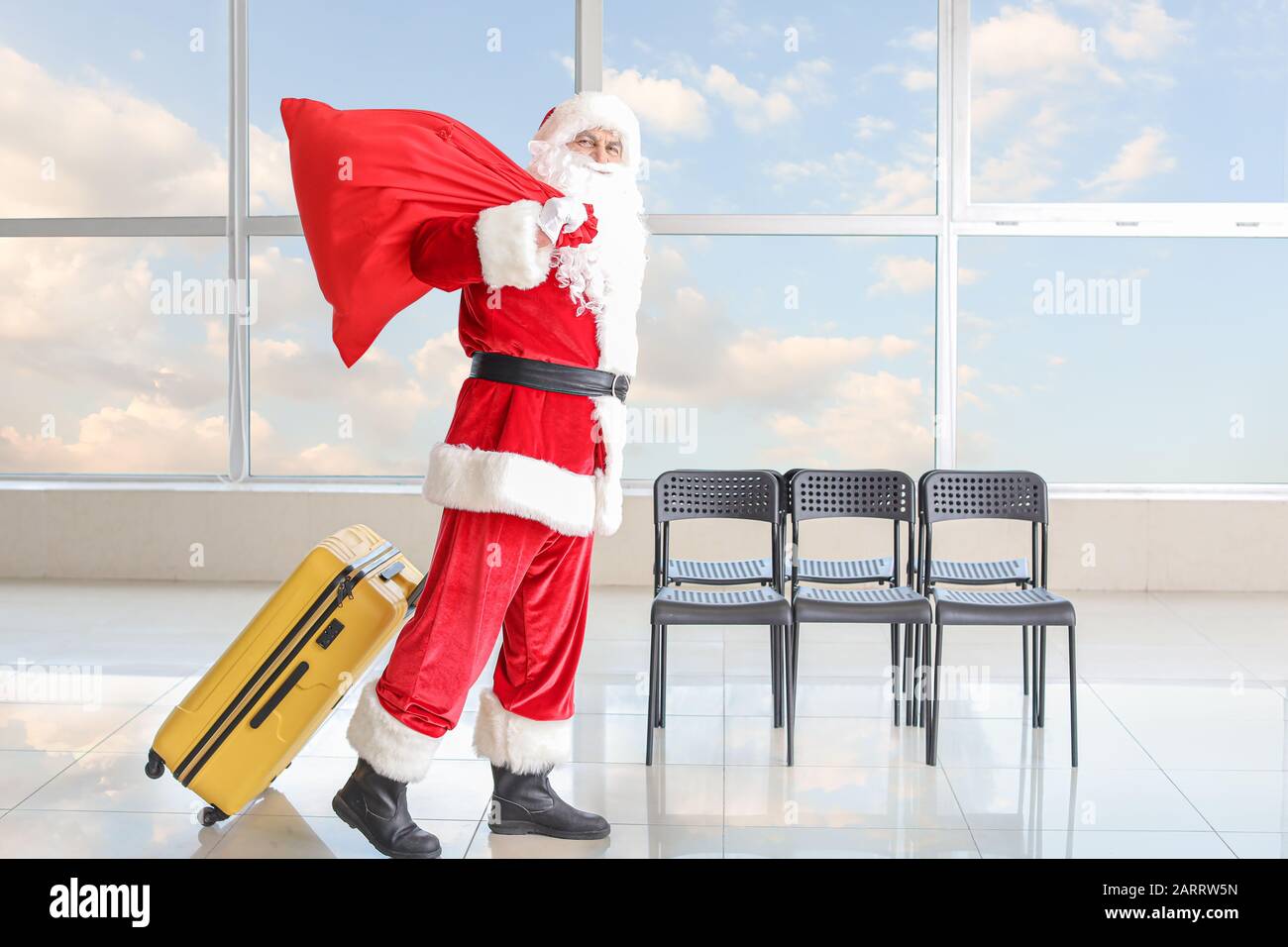 Santa Claus with luggage at the airport. Concept of vacation Stock ...