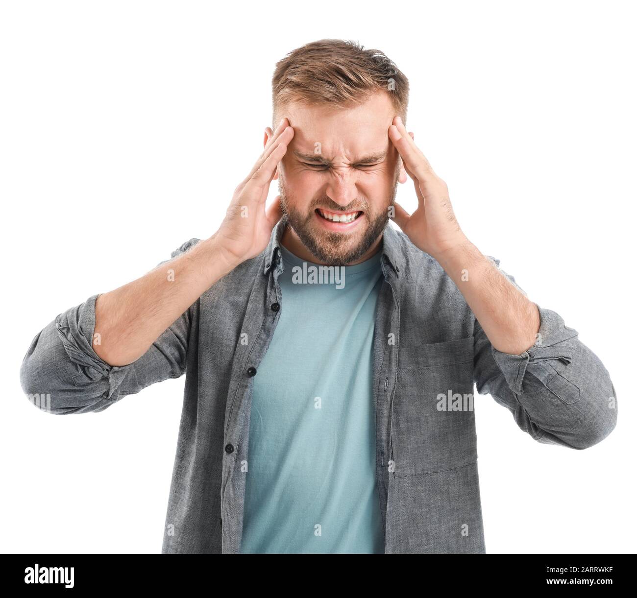 Stressed young man on white background Stock Photo - Alamy