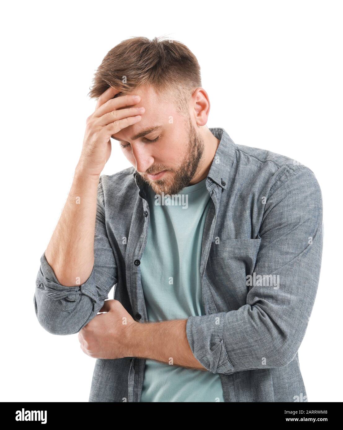 Stressed young man on white background Stock Photo - Alamy