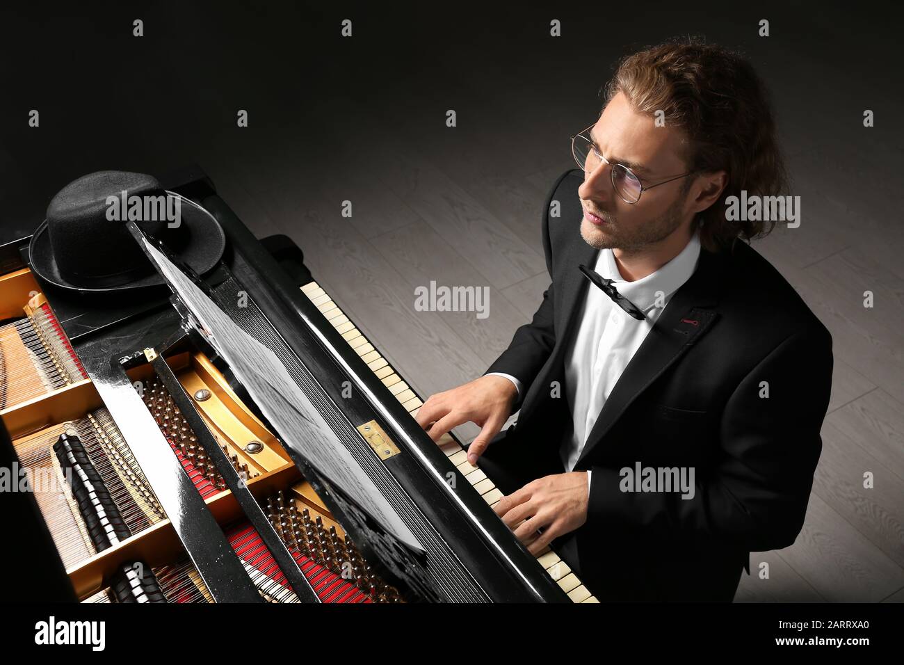 Man playing grand piano at the concert Stock Photo - Alamy