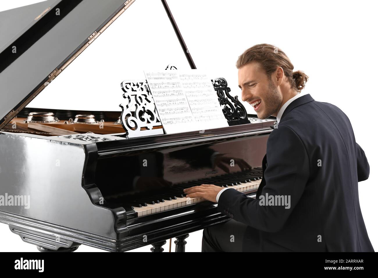 Man playing grand piano at the concert Stock Photo - Alamy