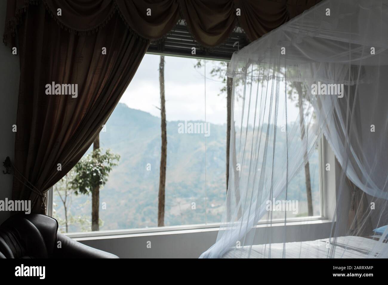 Hotel interior with large panoramic window and view of Mount Stock ...