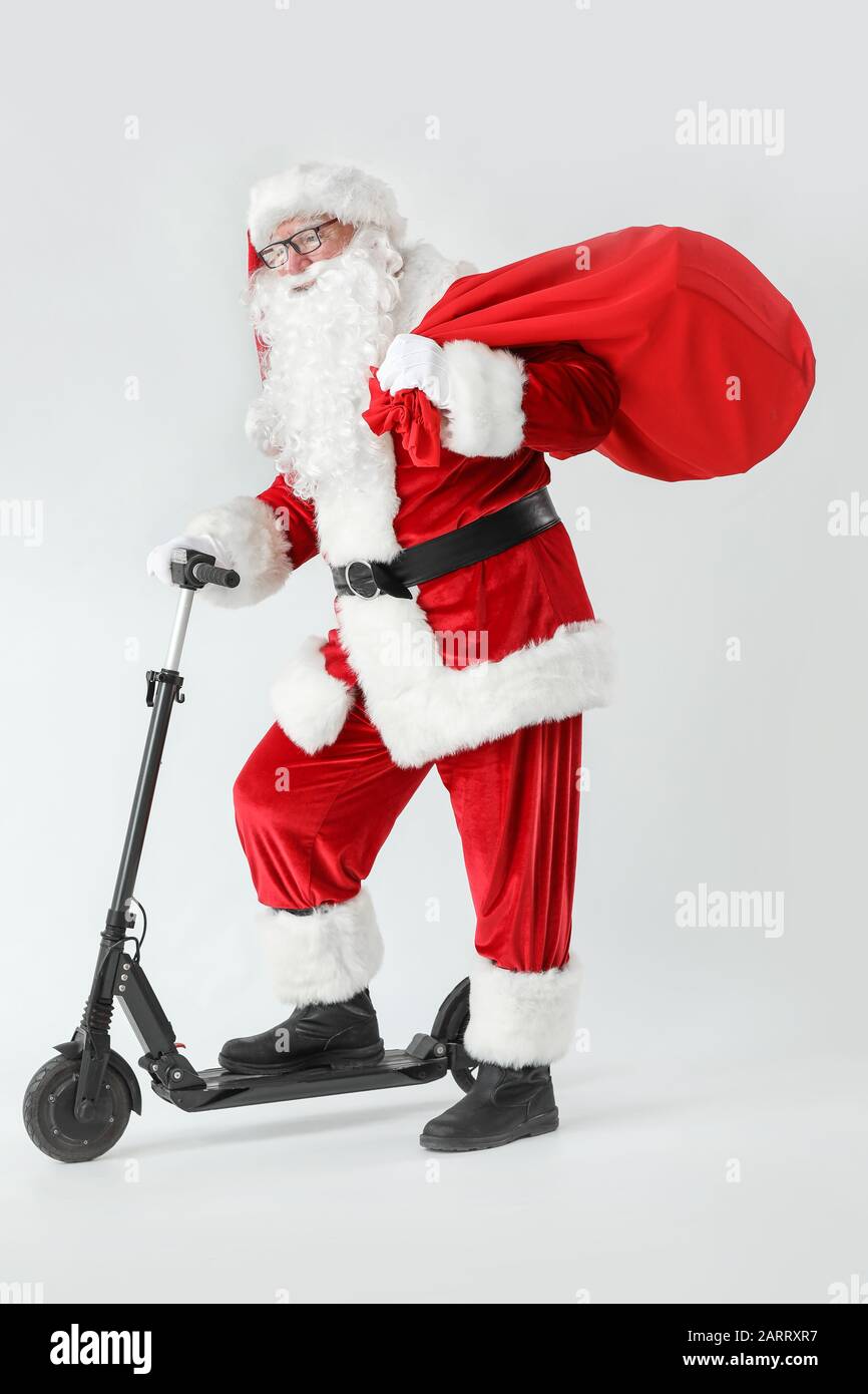 Santa claus on scooter hi-res stock photography and images - Alamy