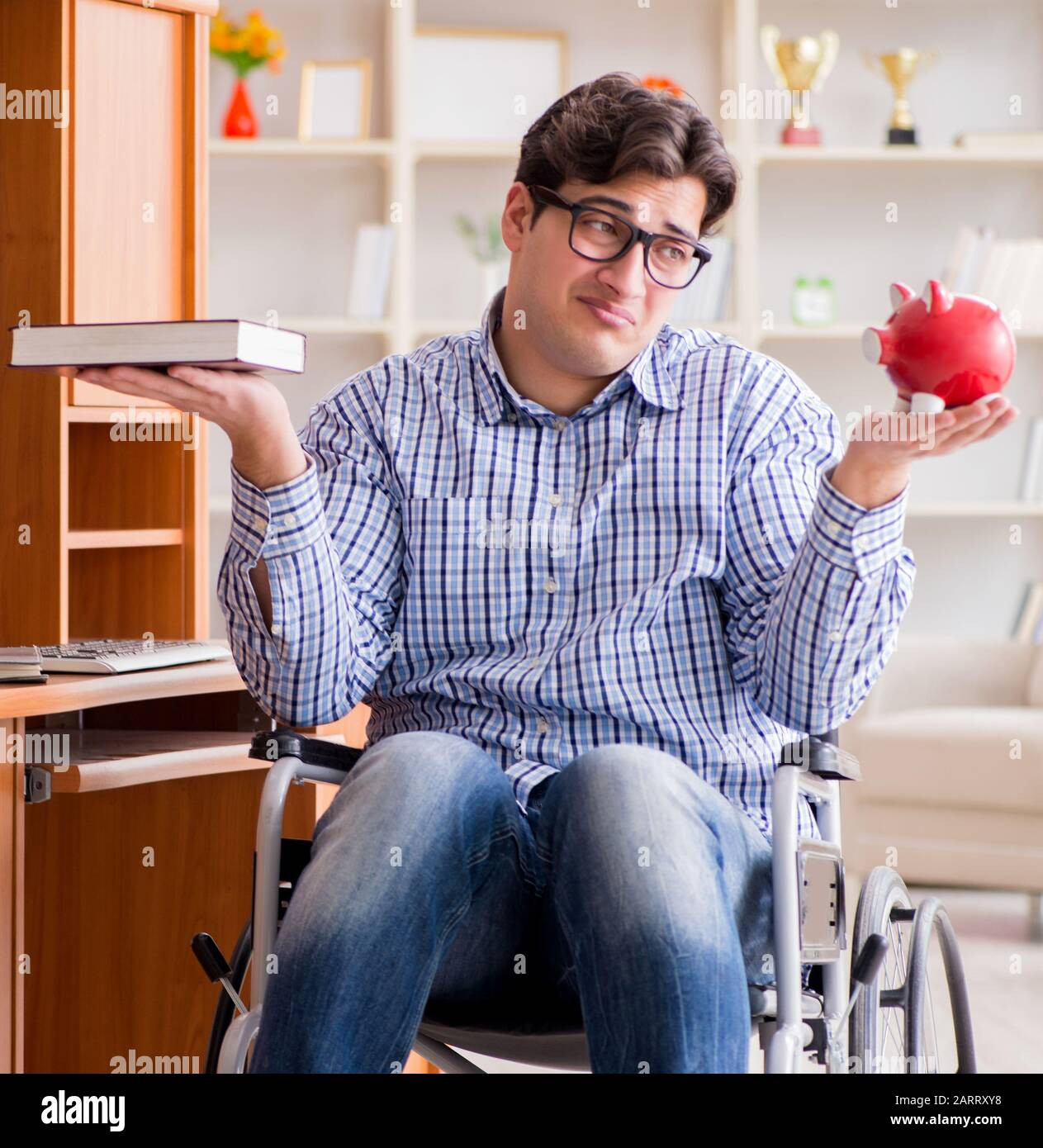 The disabled student studying at home on wheelchair Stock Photo - Alamy