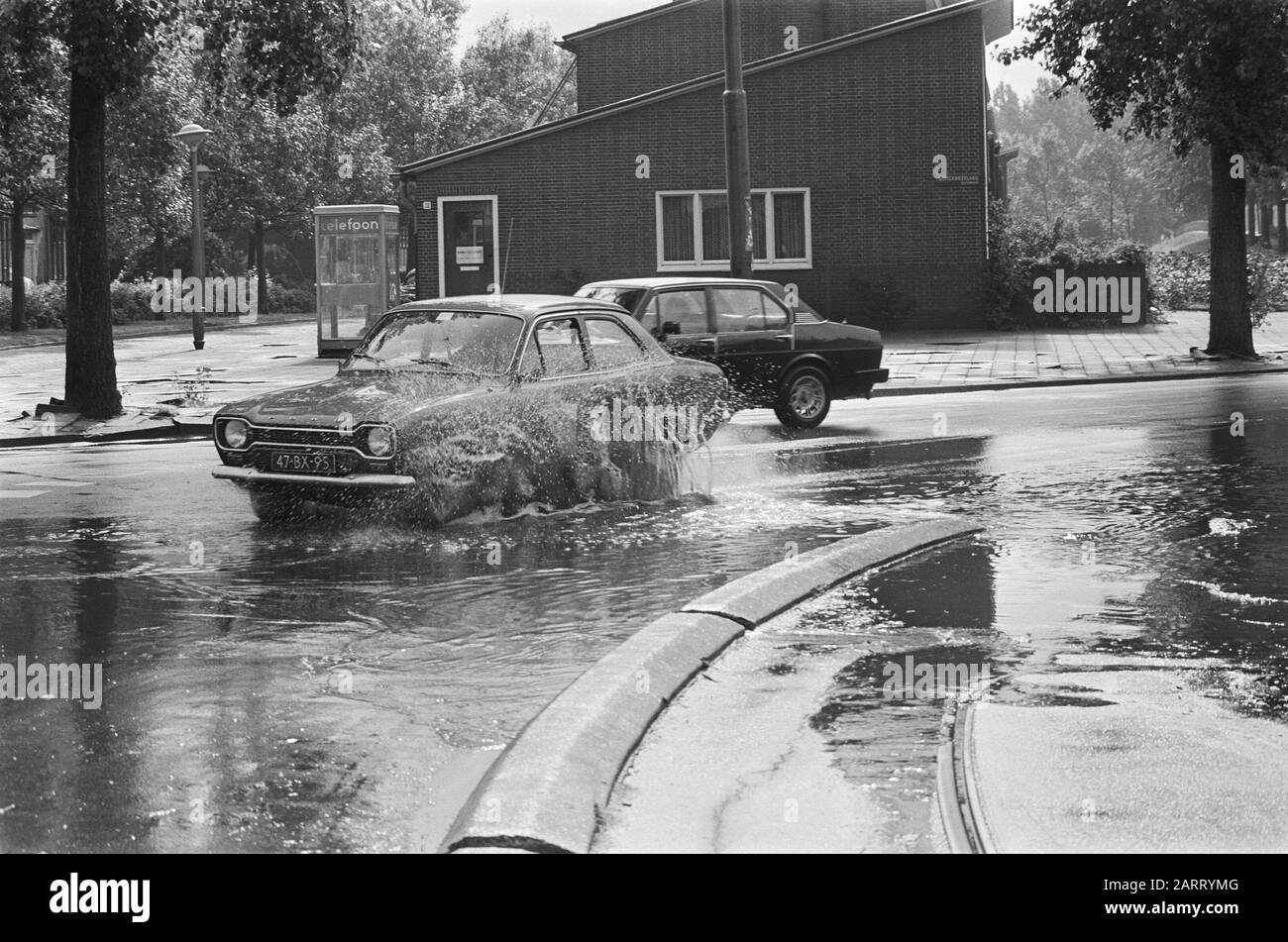 Bad weather, car driving through puddle Date: July 5, 1978 Keywords ...