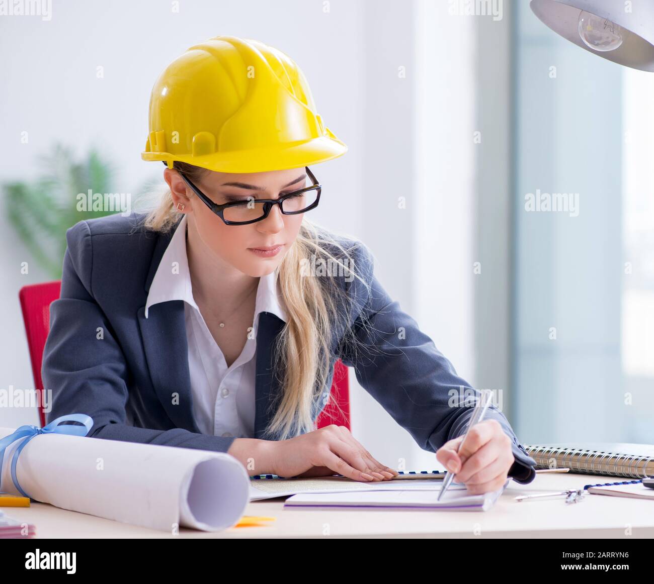 The woman architect working on the project Stock Photo - Alamy