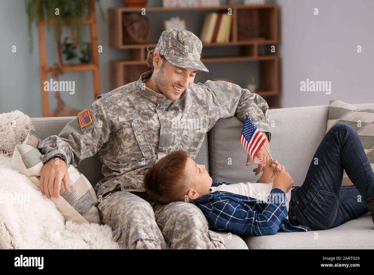 Happy military man with his son at home Stock Photo - Alamy