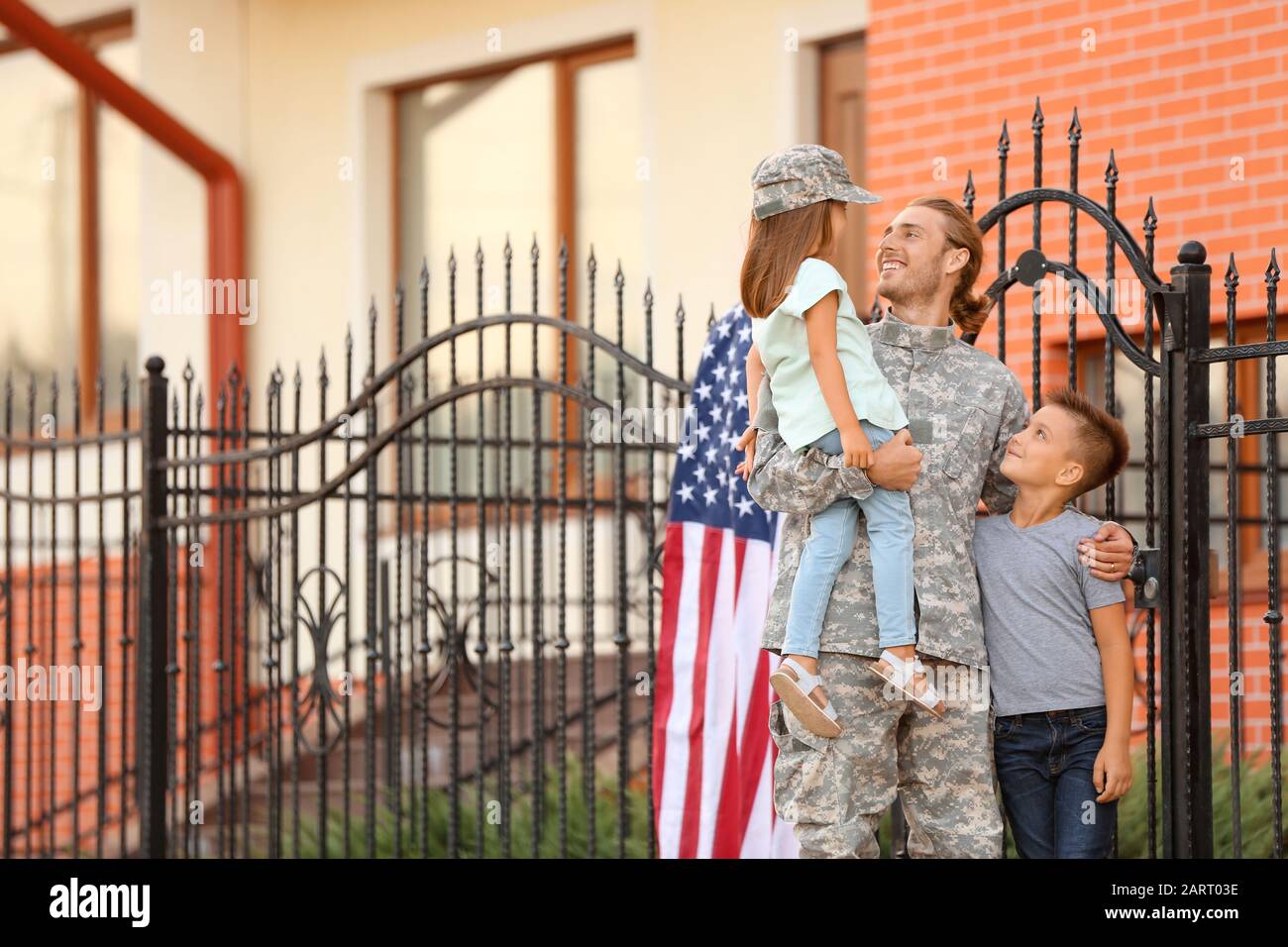 Happy military man with his children outdoors Stock Photo - Alamy