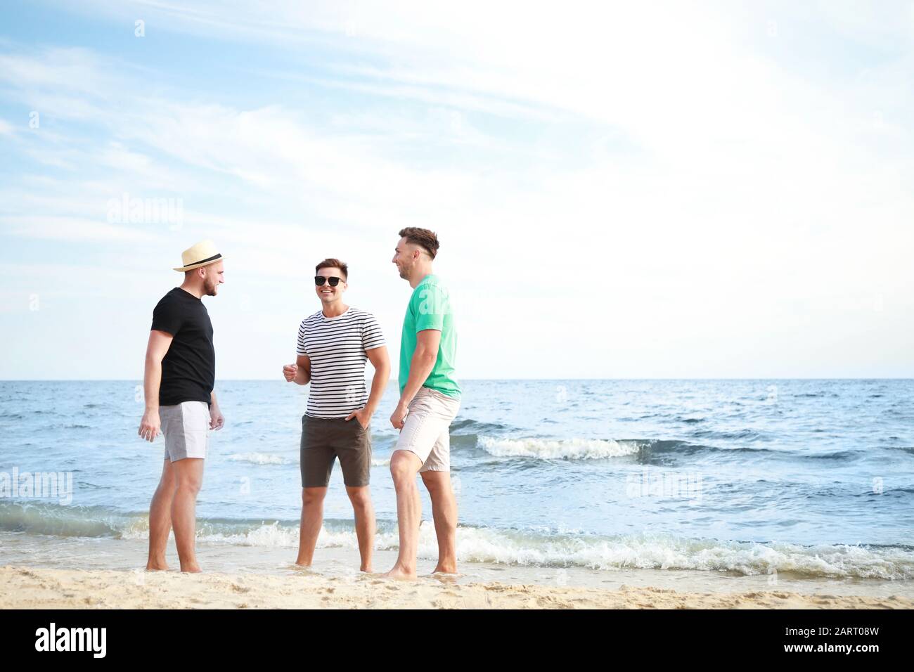 Happy friends on sea beach at resort Stock Photo - Alamy