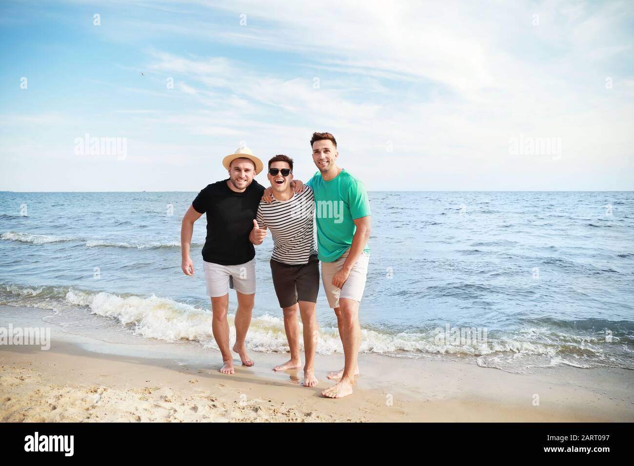 Happy friends on sea beach at resort Stock Photo - Alamy