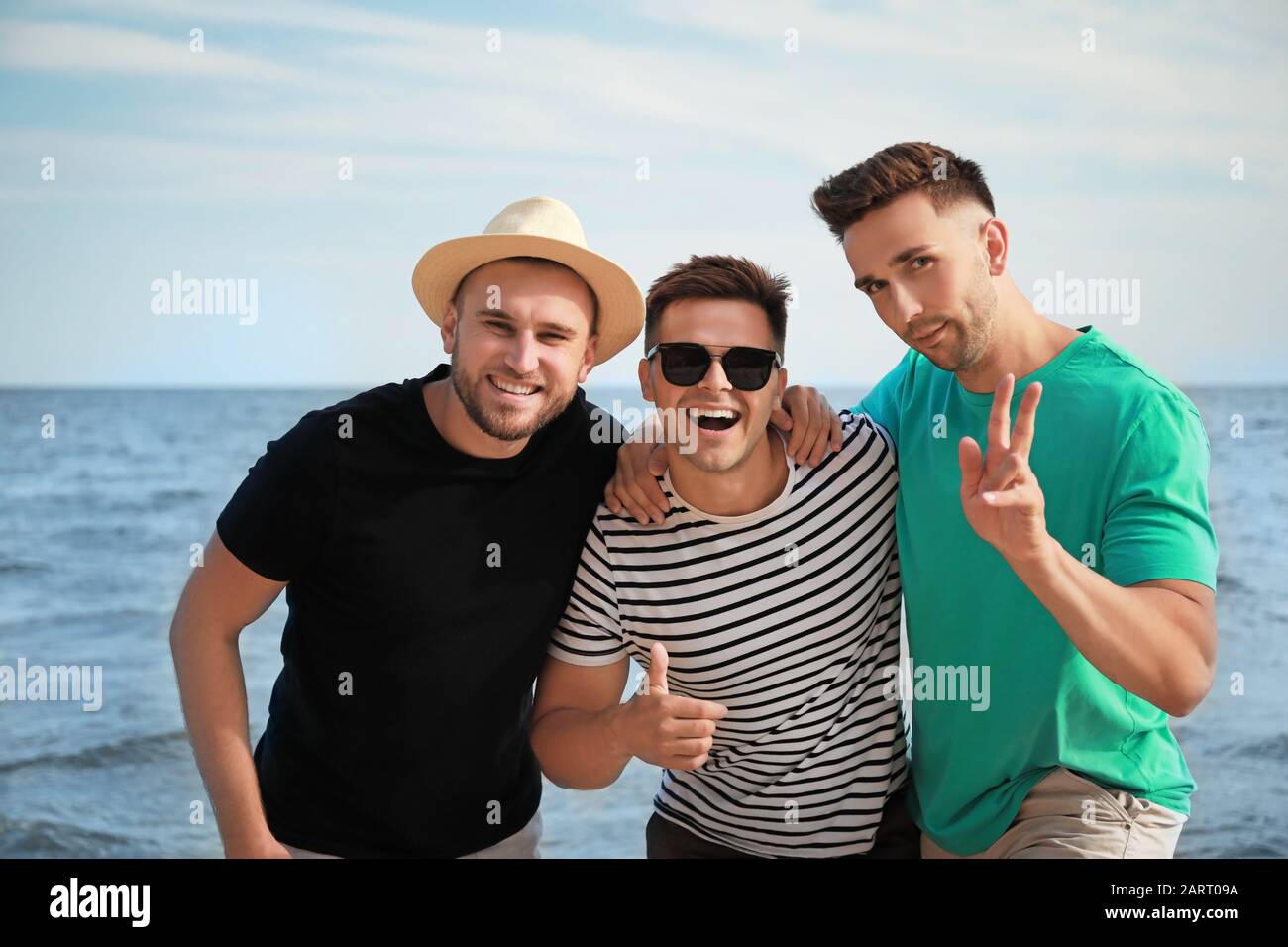 Happy friends on sea beach at resort Stock Photo - Alamy