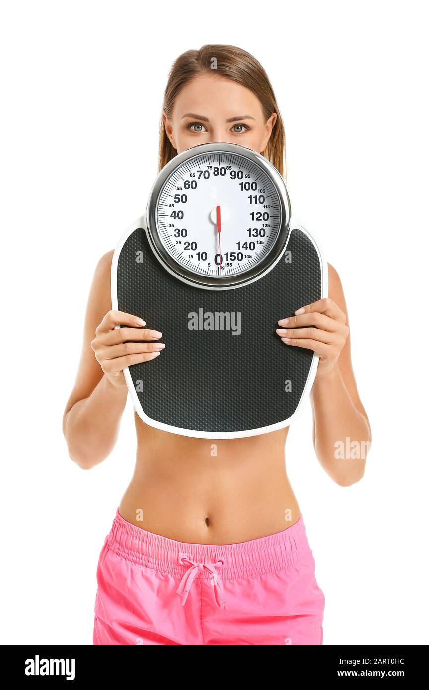 Beautiful young woman with scales on white background. Weight loss ...