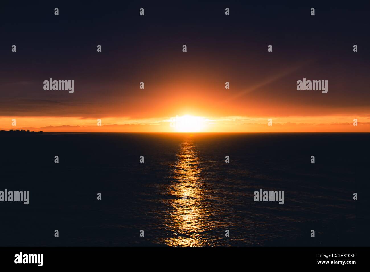 Sunset through clouds Hawaii Stock Photo - Alamy