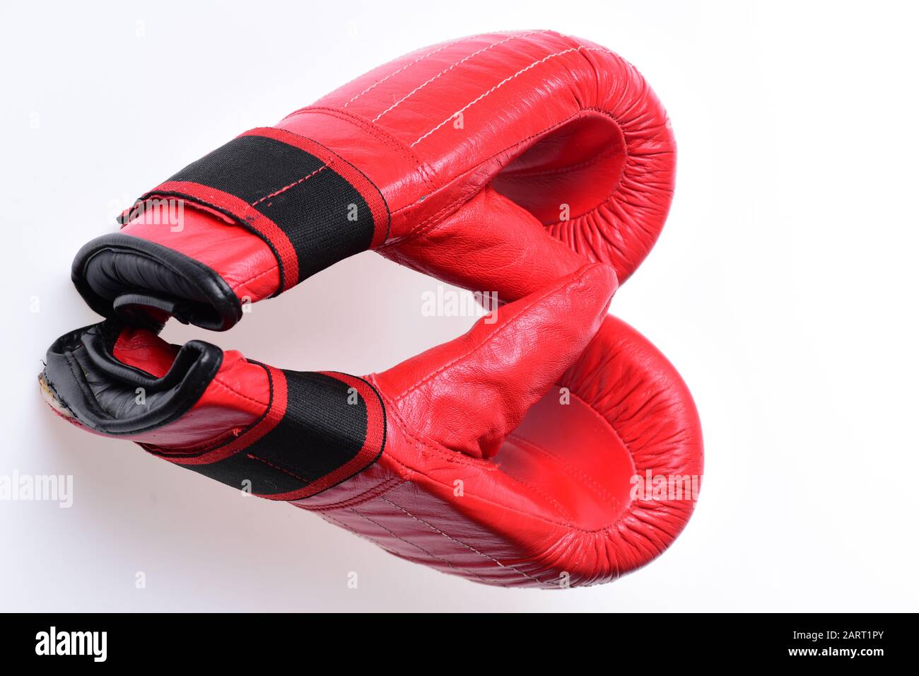Pair of boxing gloves lying on each other. Protection and strength ...