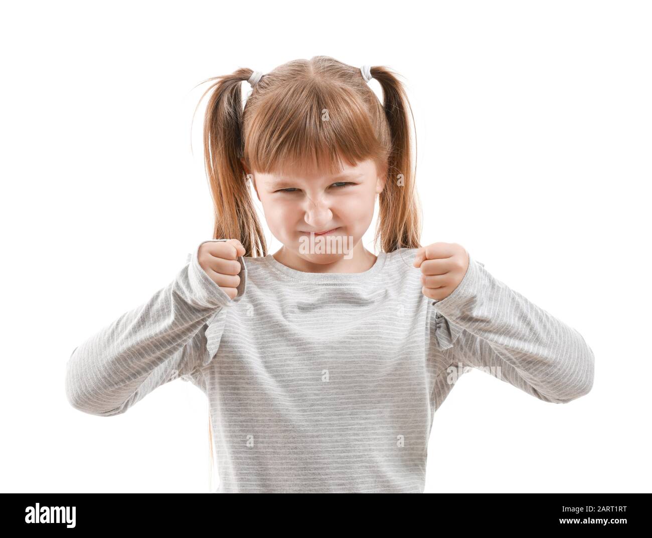 Portrait of angry little girl on white background Stock Photo - Alamy