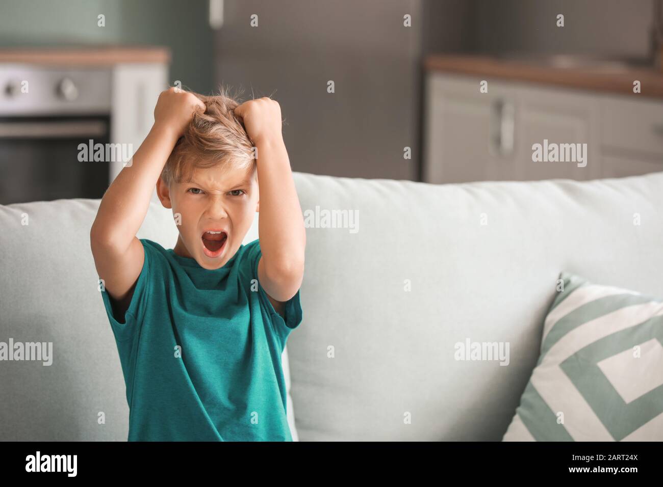 Portrait of angry little boy at home Stock Photo - Alamy