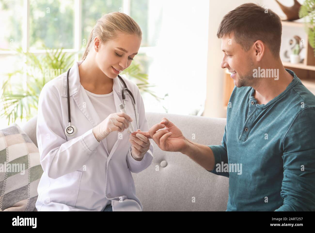 Doctor taking blood sample hi-res stock photography and images - Alamy